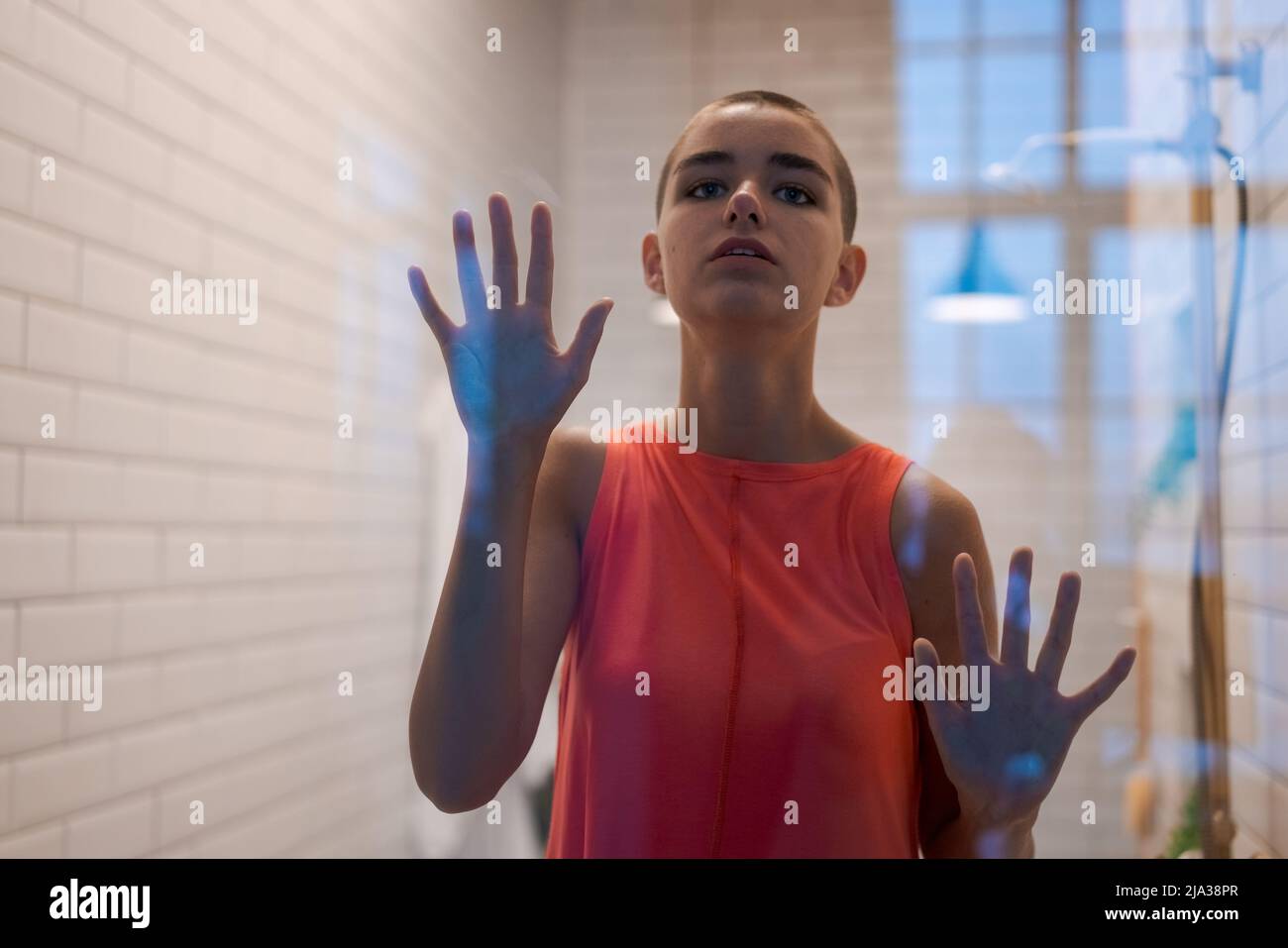 Frustrated young woman is standing in bathroom. Depression crying have ...