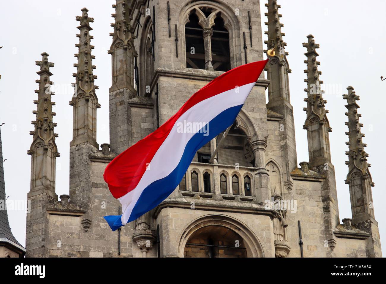Flags on the ancient town hall at the Markt of Gouda during celebration ...