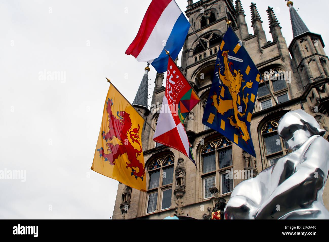 Flags on the ancient town hall at the Markt of Gouda during celebration ...