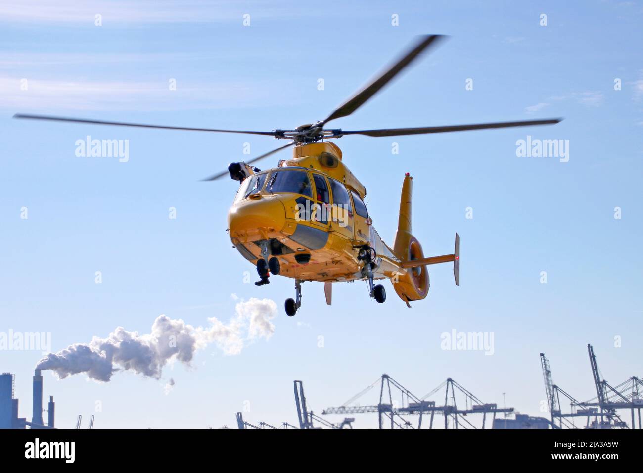 SAR rescue helicopter of the Dutch coast guard is taking off the ground ...