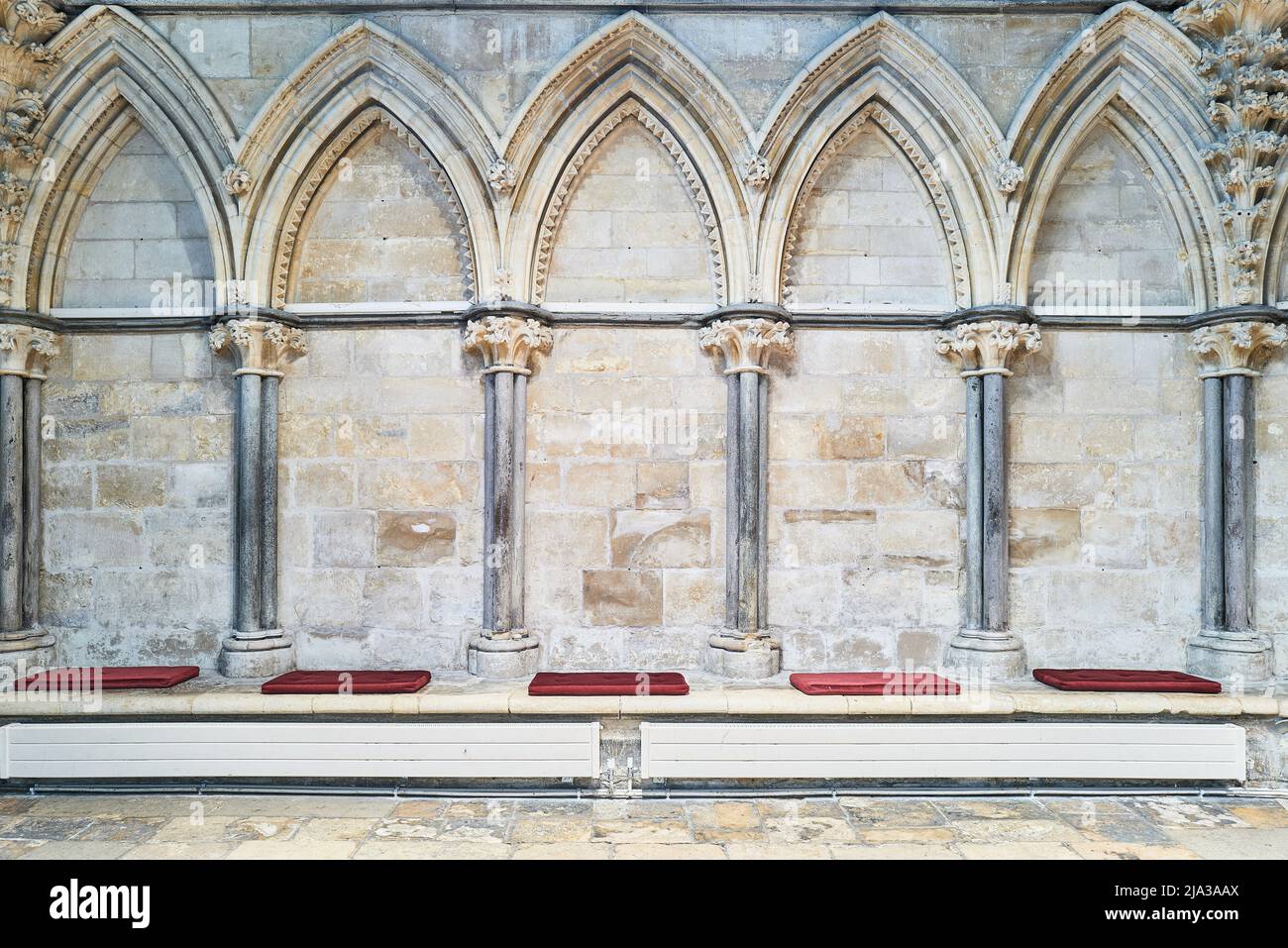 Cushions on the seats in the Chapter House of the christian medieval ...