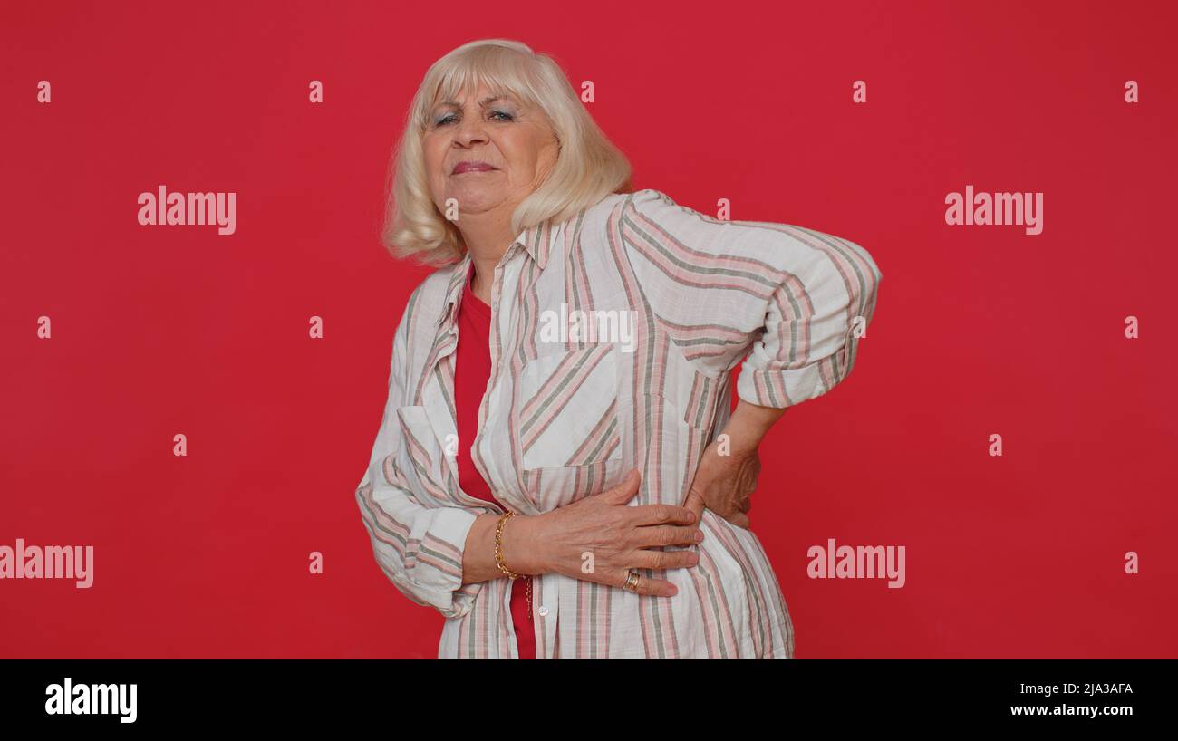 Senior ill woman suffering backache discomfort unbearable spasm torn ...