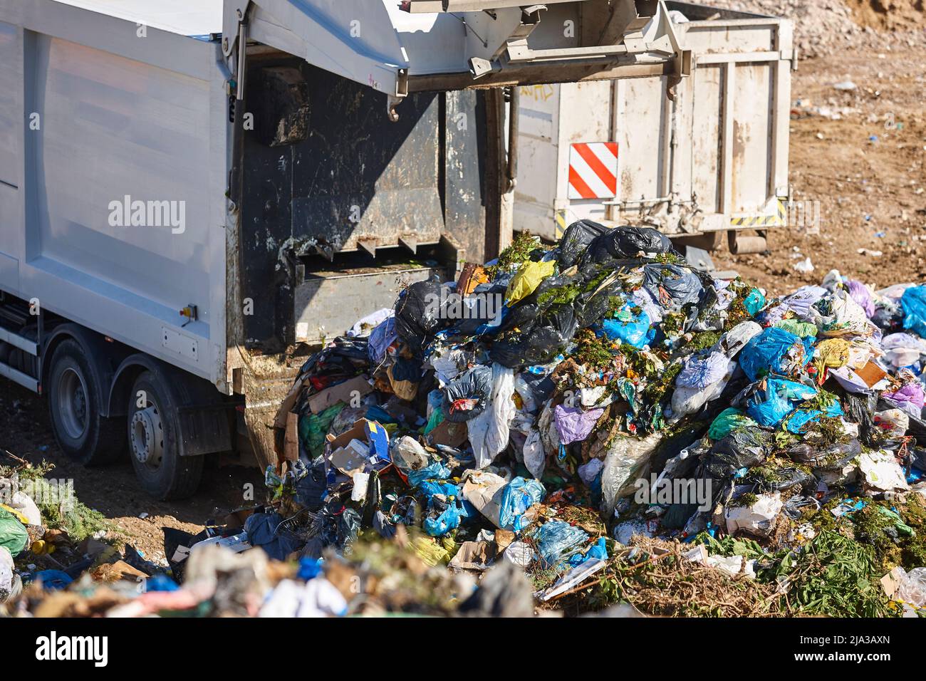 Truck unloading garbage on an open air dump. Waste recycling Stock ...