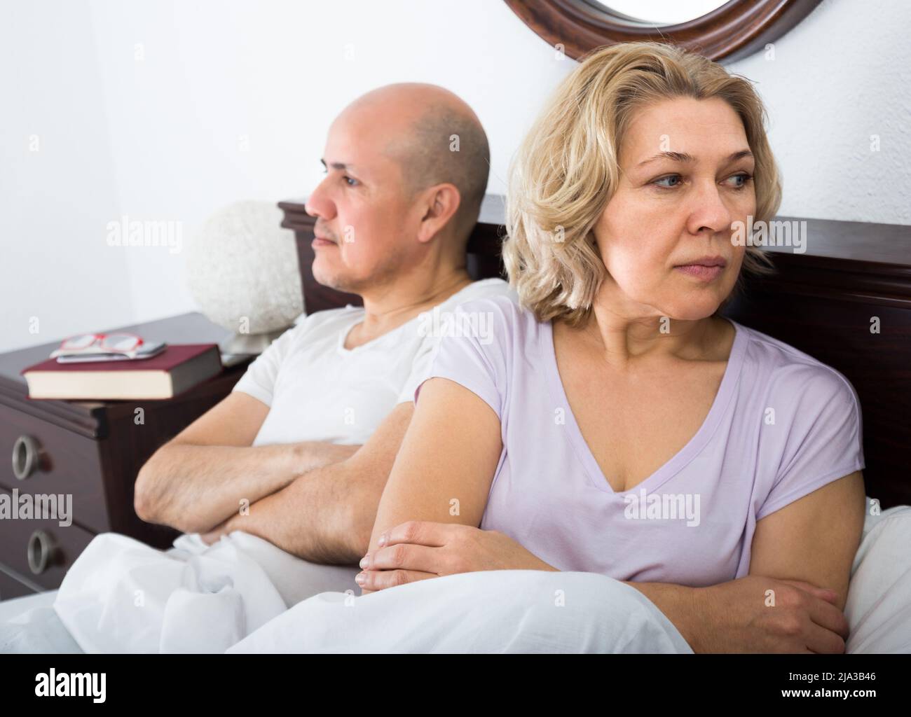 Mature unhappy couple bed hi-res stock photography and images - Alamy