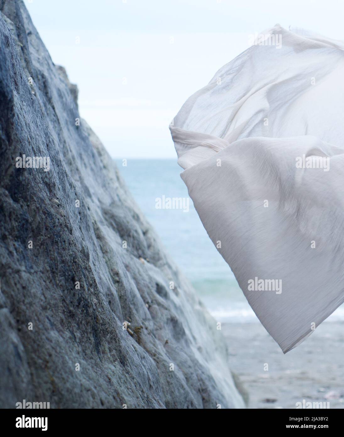 Cream Linen fabric blowing in the wind at the coastline Stock Photo - Alamy