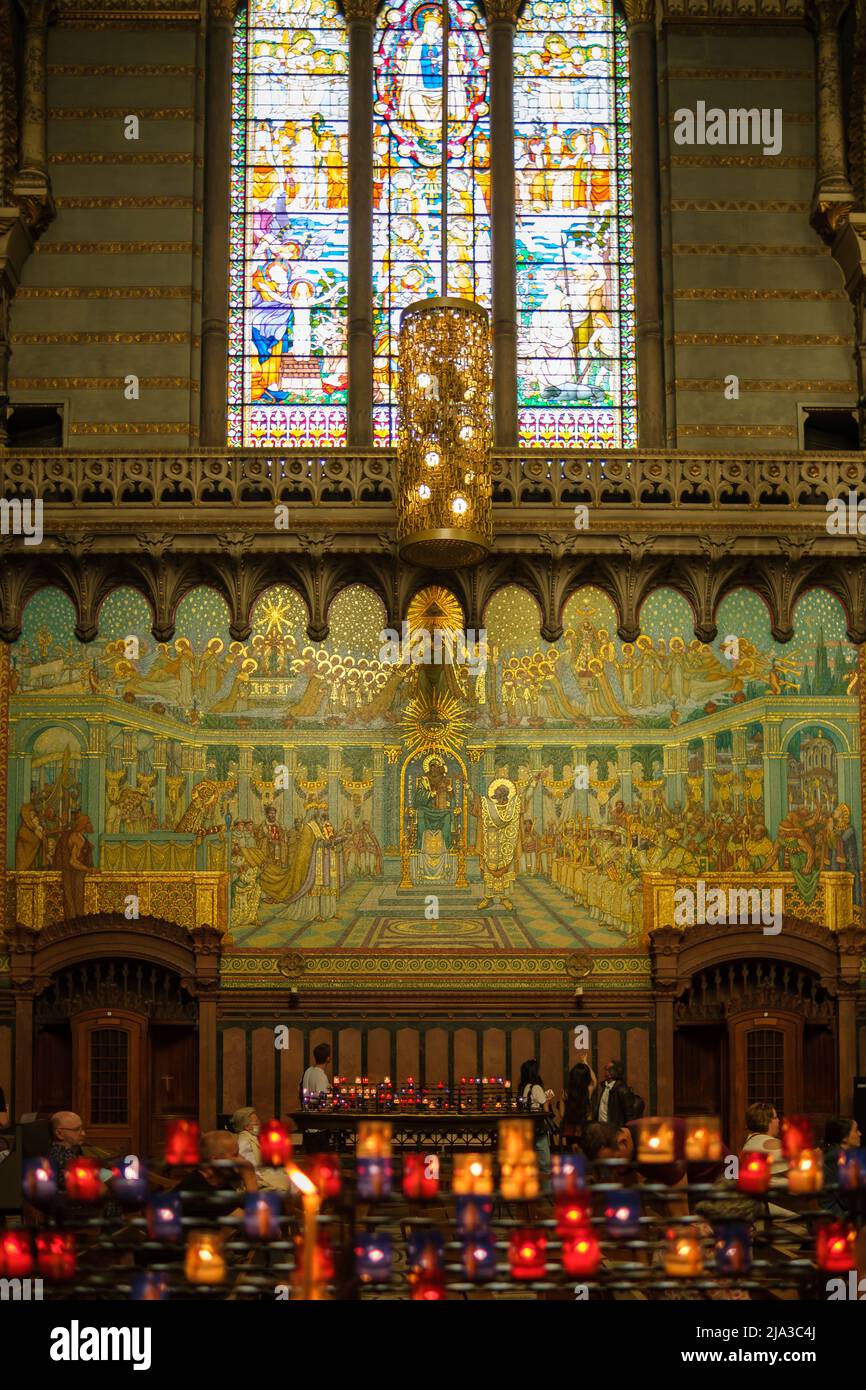 Lyon, France - May 10, 2022 : Colorful candles and decorated stained ...
