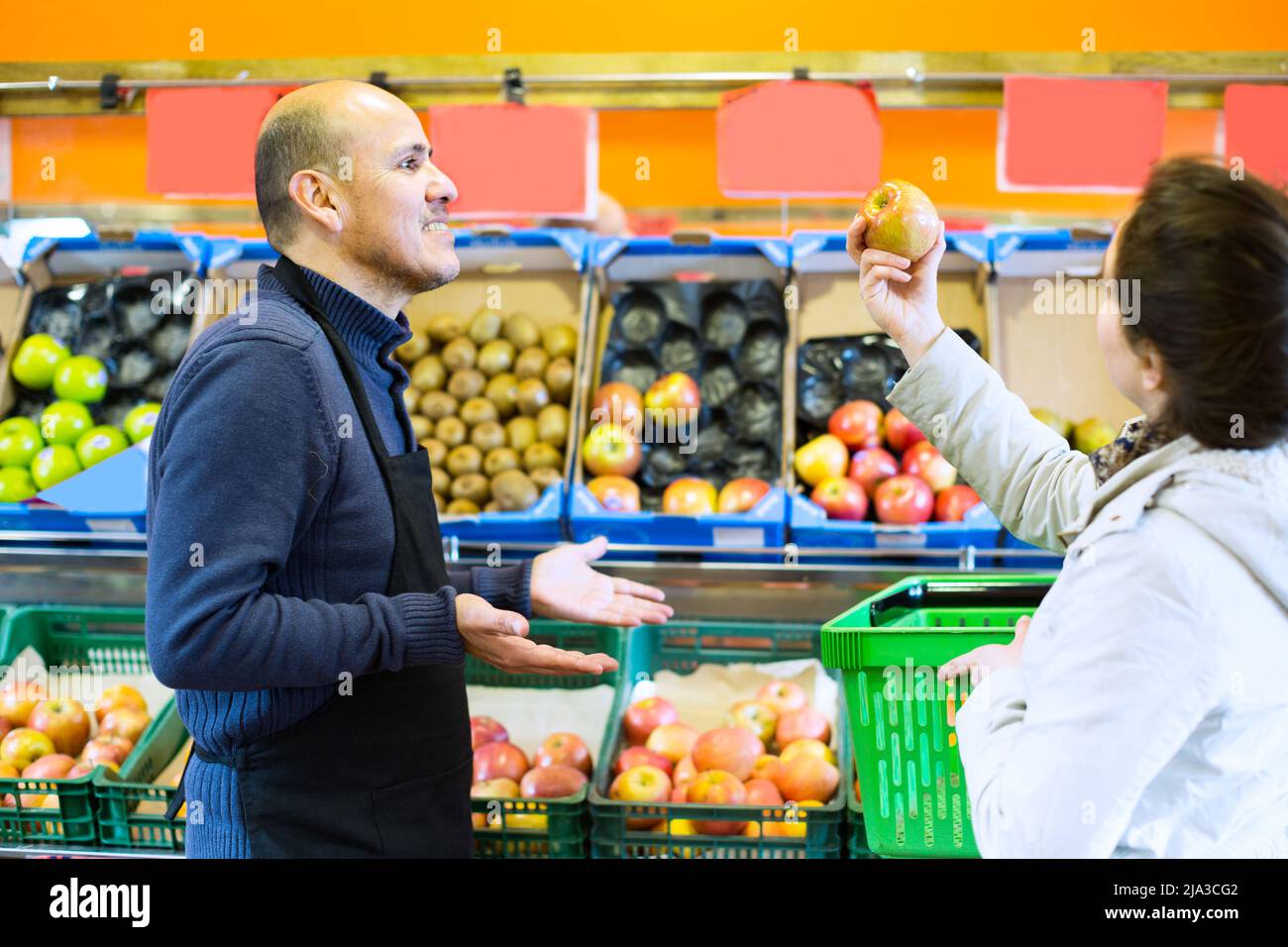 Woman choosing fruits hi-res stock photography and images - Alamy
