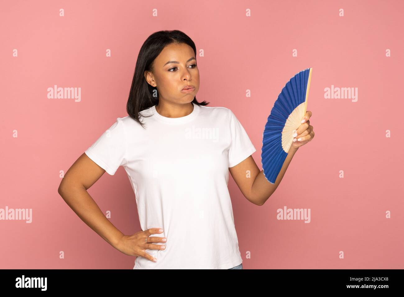Overheated african woman using paper fan suffer from heat sweating ...
