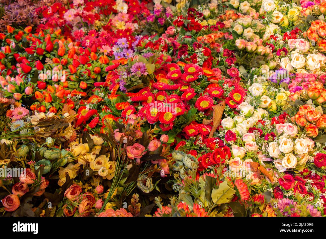 Floral art made of colorful artificial flowers in view Stock Photo - Alamy