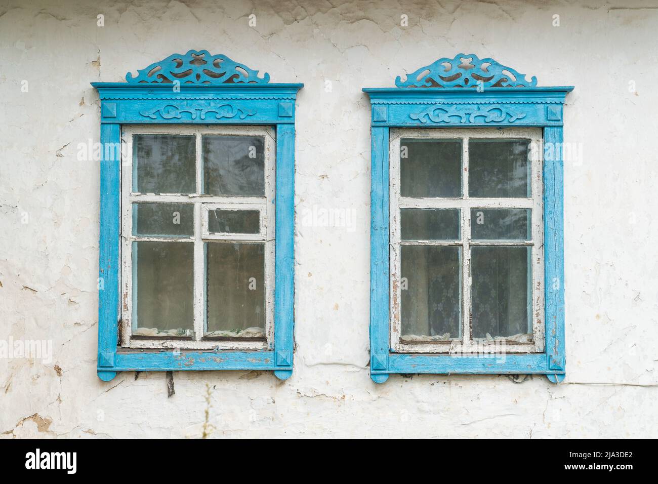 Carved wooden windows in old wooden houses in Oleshnia village ...