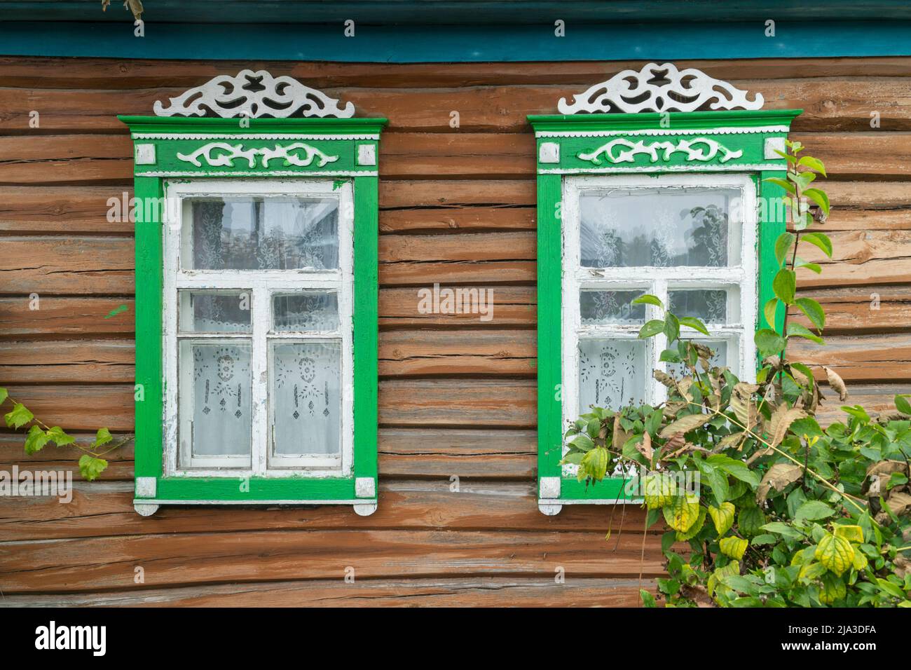 Carved wooden windows in old wooden houses in Oleshnia village ...