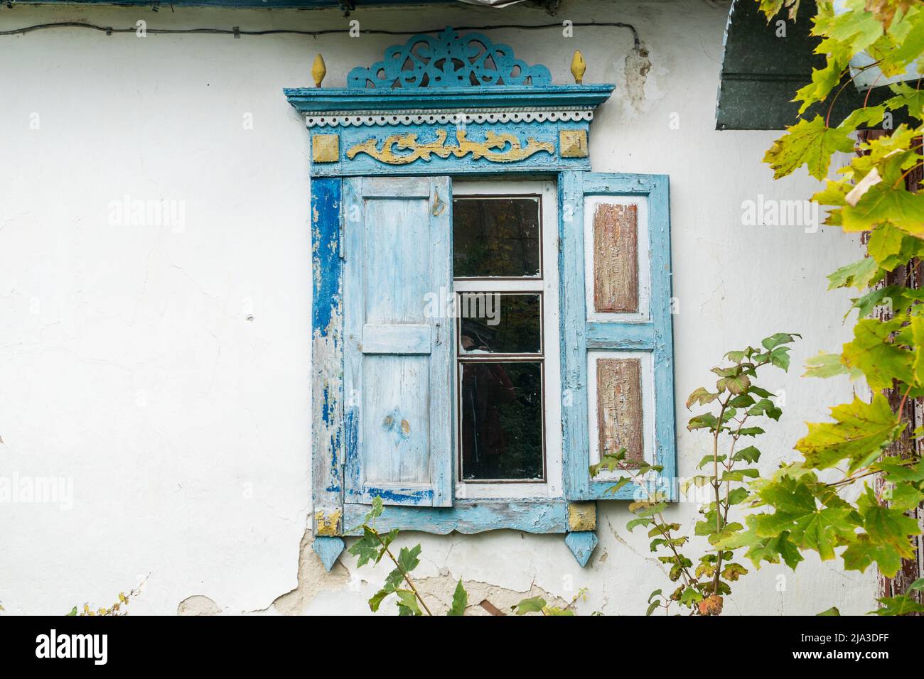 Carved wooden windows in old wooden houses in Oleshnia village ...