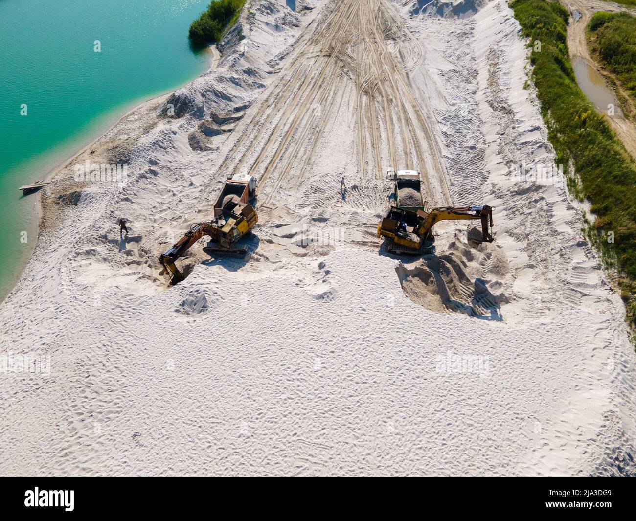 heavy industry overhead view of excavator at sand quarry summer sunny ...