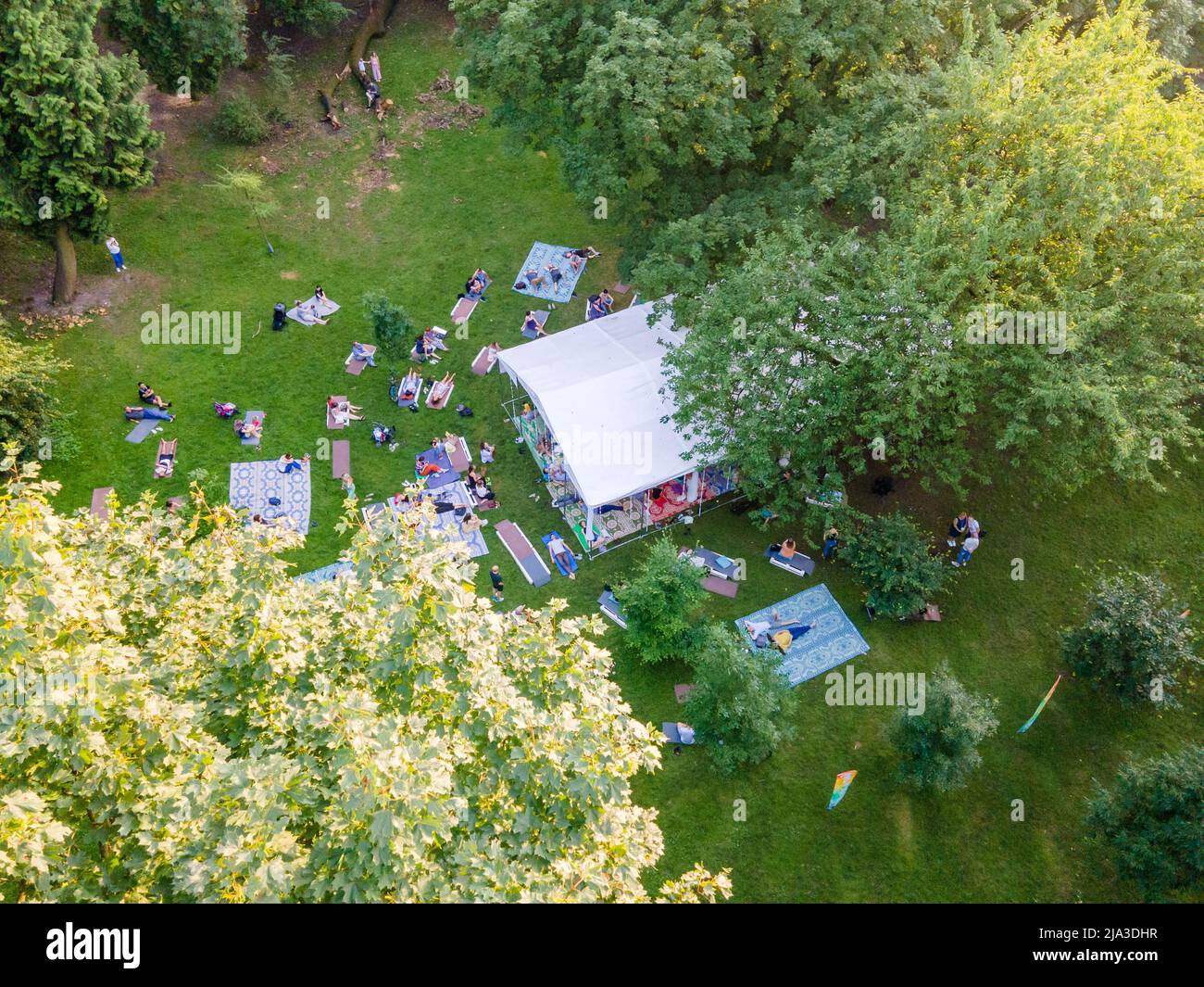 people laying down at city public park overhead top view outside ...