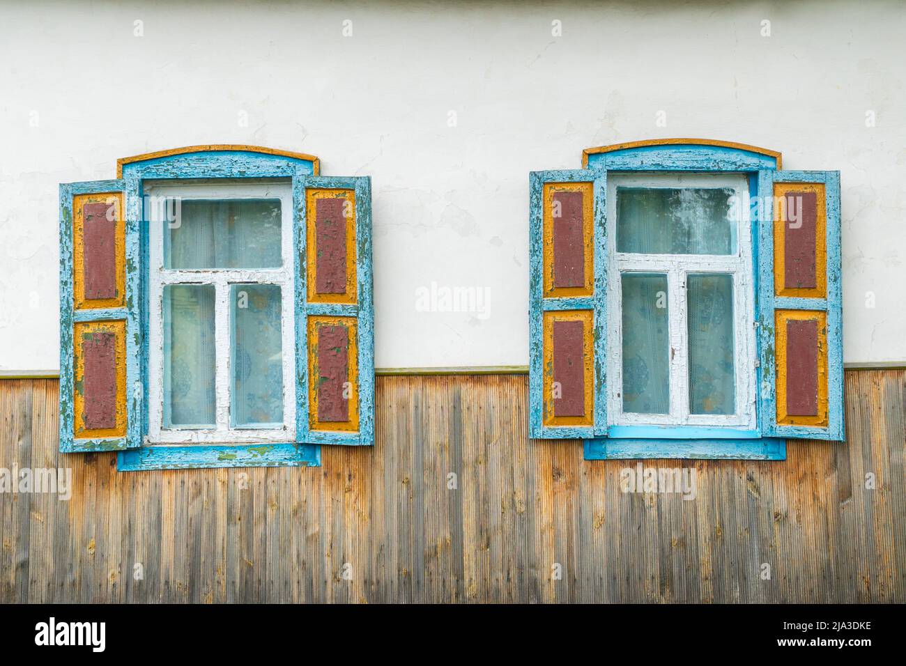 Carved wooden windows in old wooden houses in Oleshnia village ...