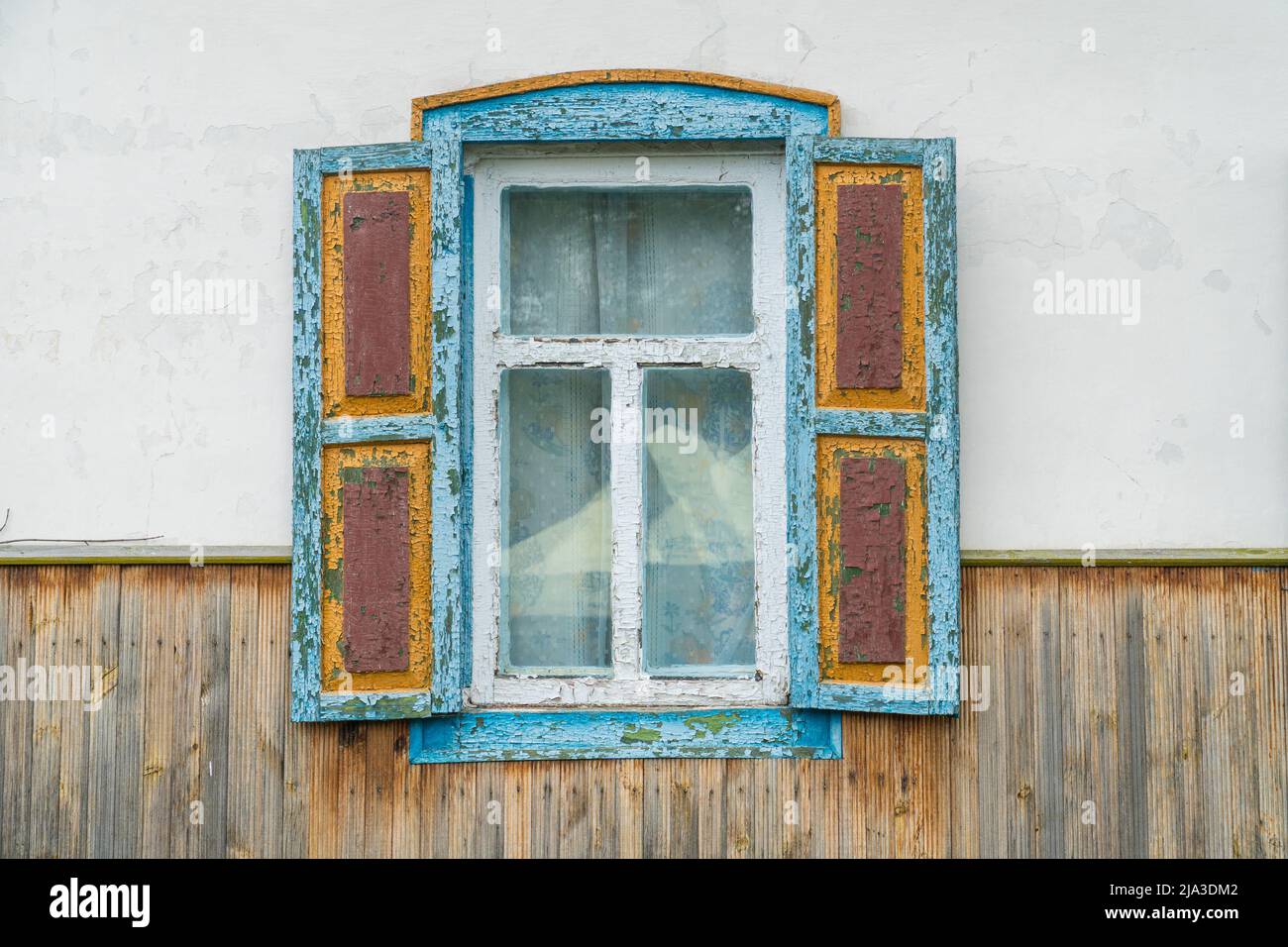Carved wooden windows in old wooden houses in Oleshnia village ...