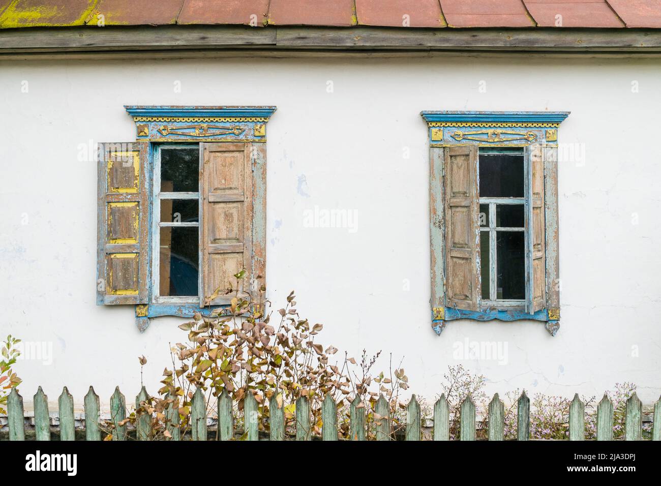 Carved wooden windows in old wooden houses in Oleshnia village ...