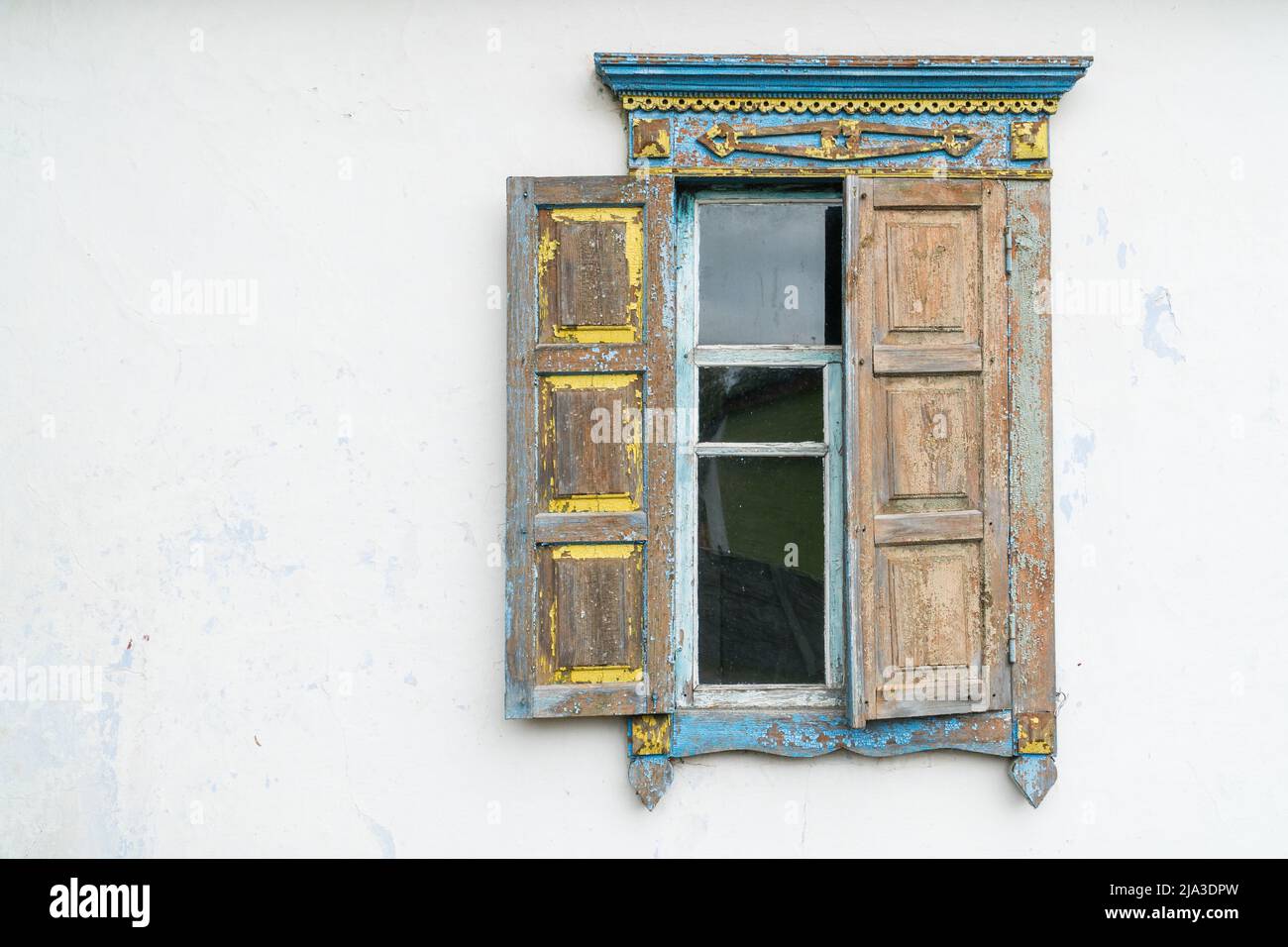 Carved wooden windows in old wooden houses in Oleshnia village ...