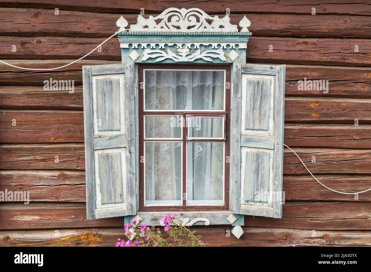 Carved wooden windows in old wooden houses in Oleshnia village ...