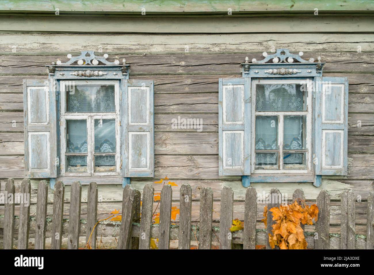 Carved wooden windows in old wooden houses in Oleshnia village ...
