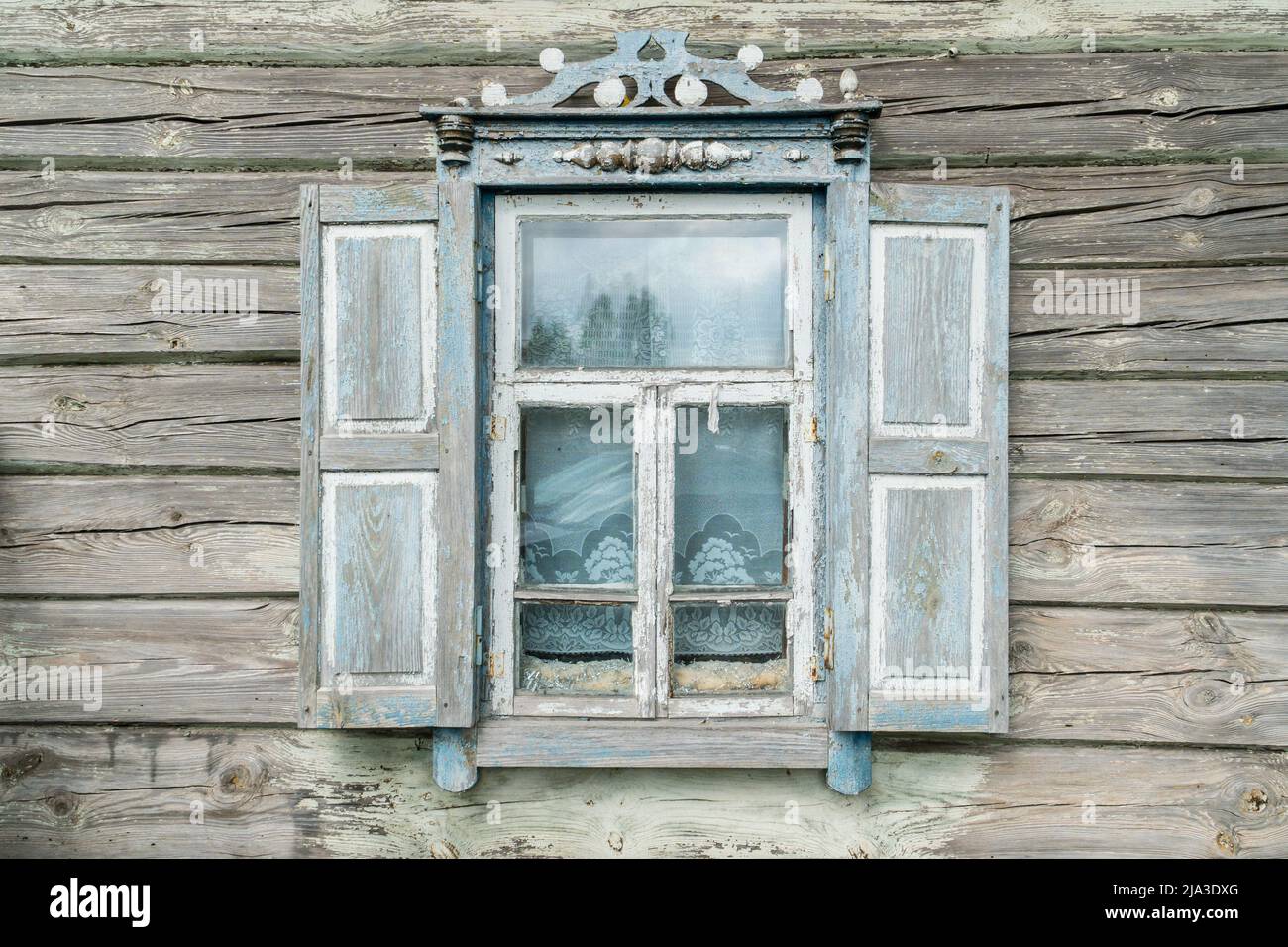 Carved wooden windows in old wooden houses in Oleshnia village ...