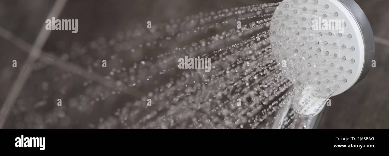 A stream of water is pouring from the shower head Stock Photo - Alamy
