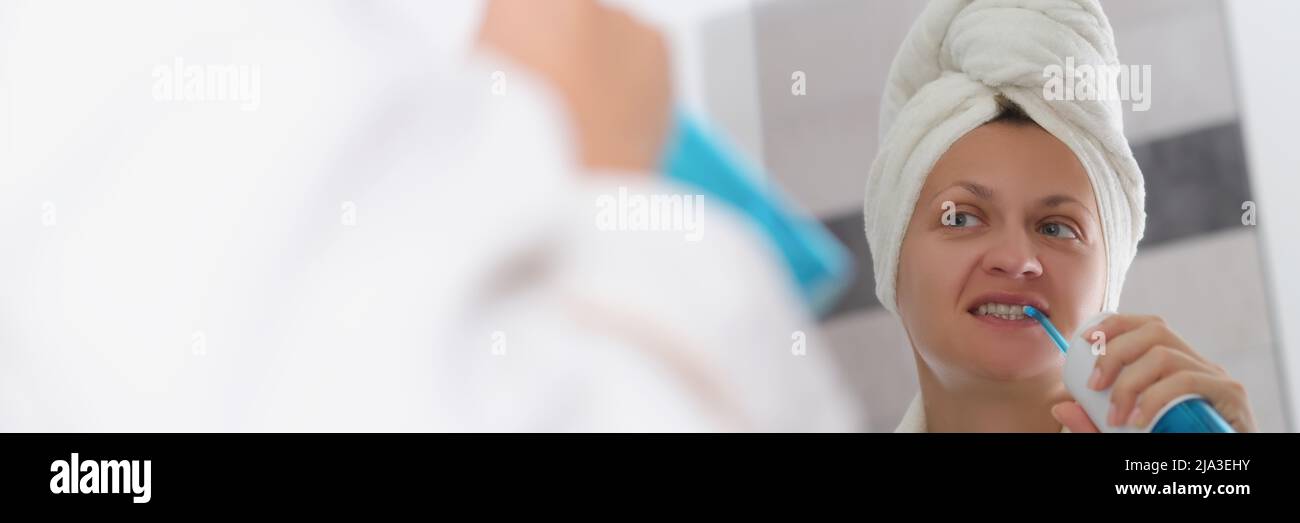 Woman brushing teeth hand hi-res stock photography and images - Alamy