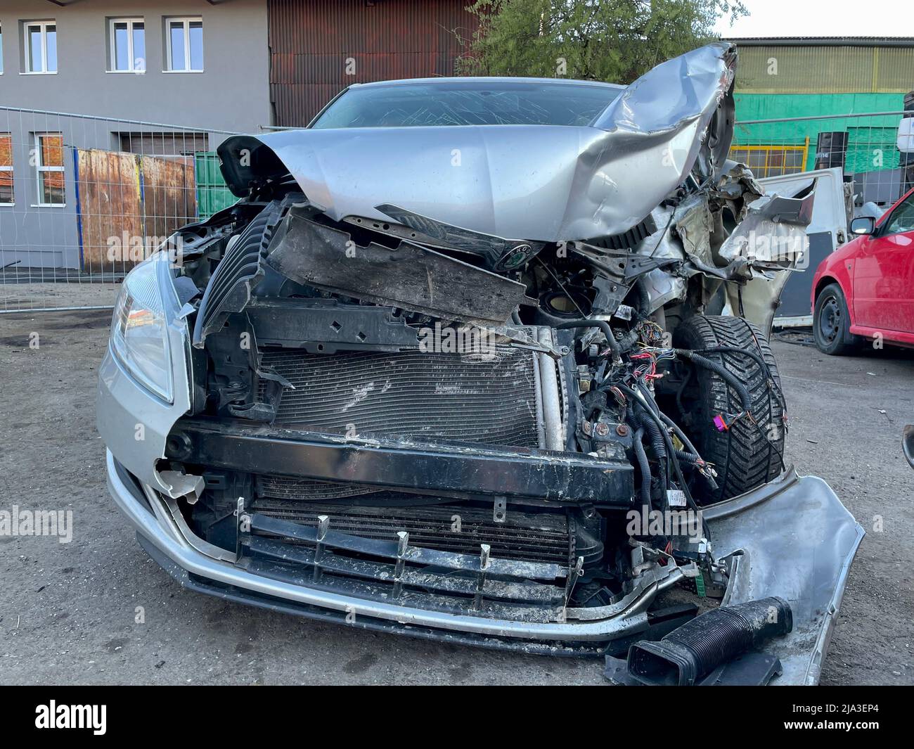 View of the front of a car badly damaged during a car accident. In this ...