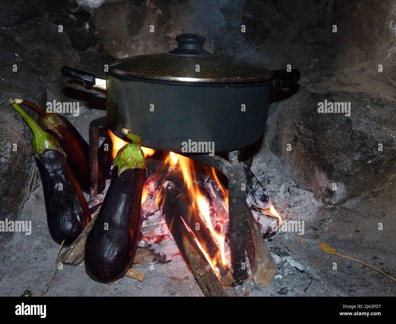 pot with food on the local fire stove Stock Photo - Alamy