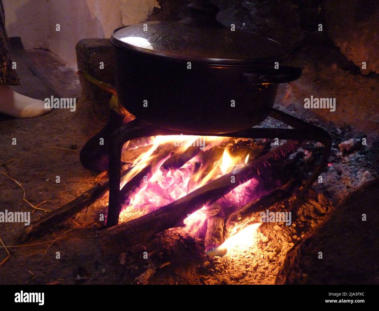 pot with food on the local fire stove Stock Photo - Alamy