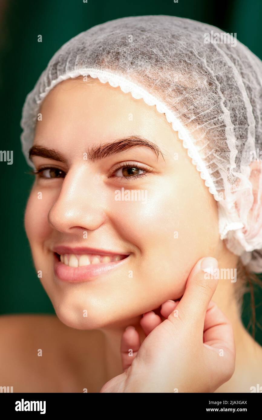 Plastic surgery and beauty concept. Professional cosmetician examining ...