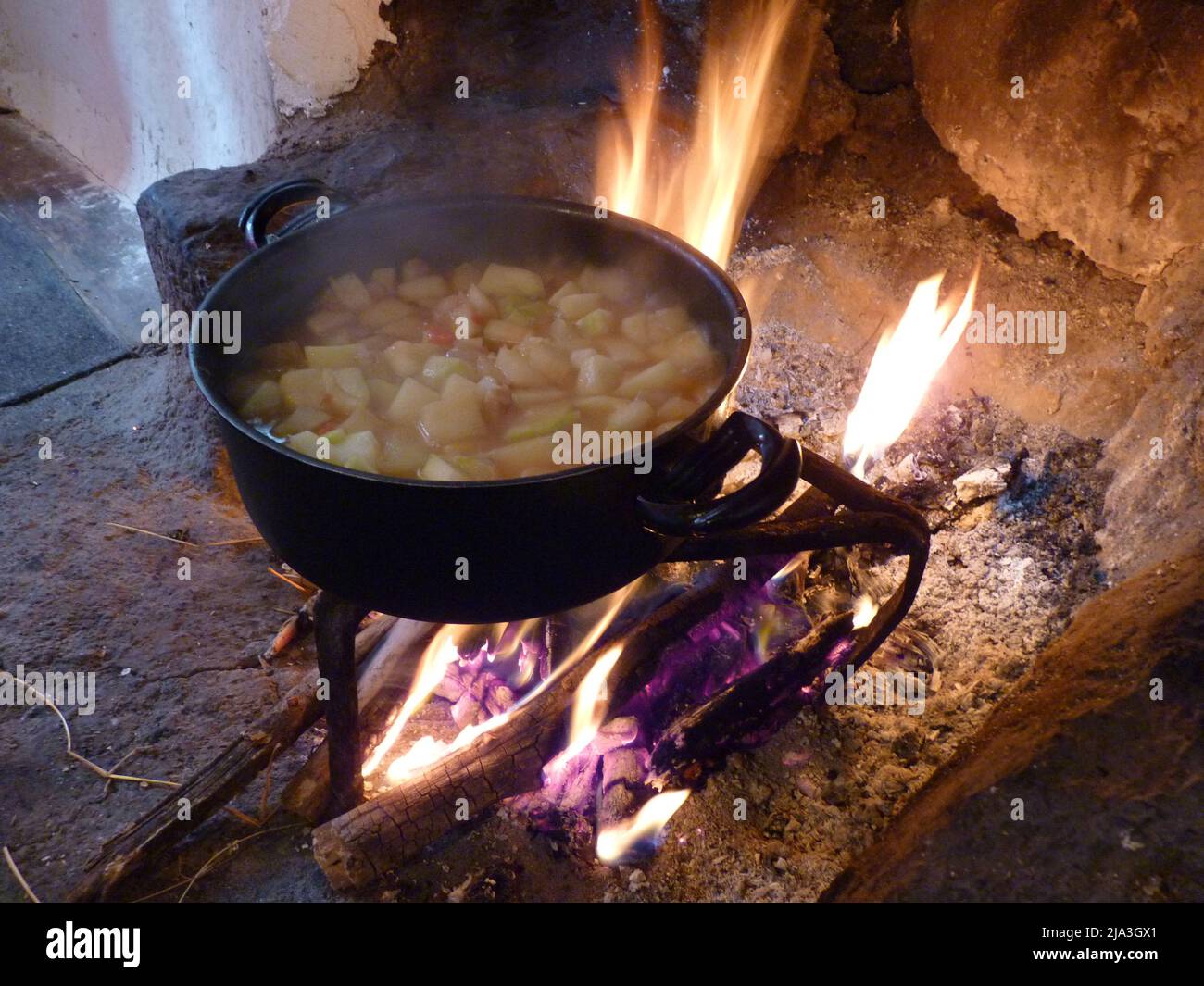 pot with food on the local fire stove Stock Photo - Alamy