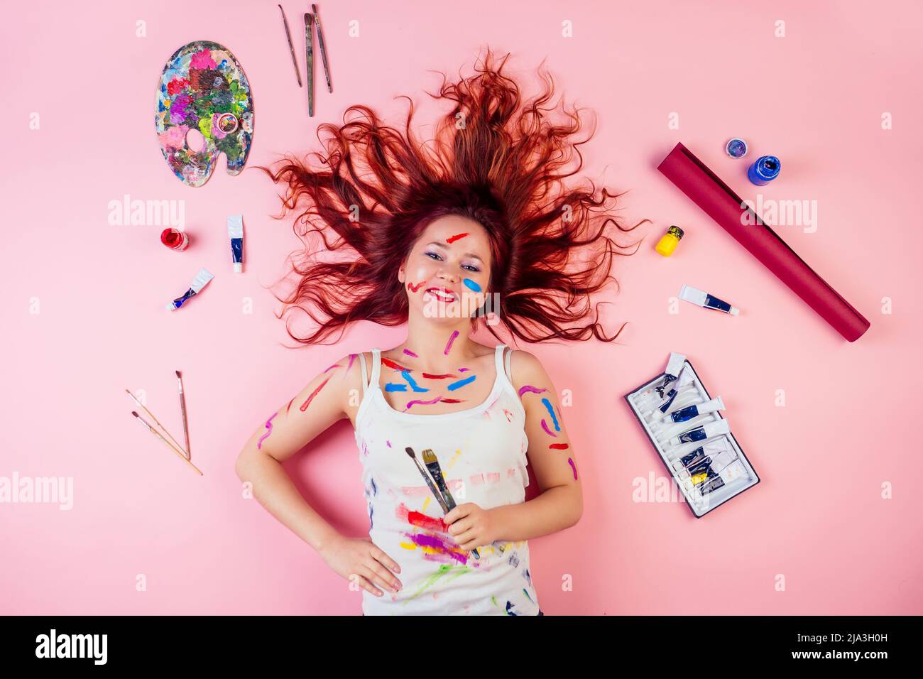 fun dirty artist painter stains blot from paint on the face resting ...