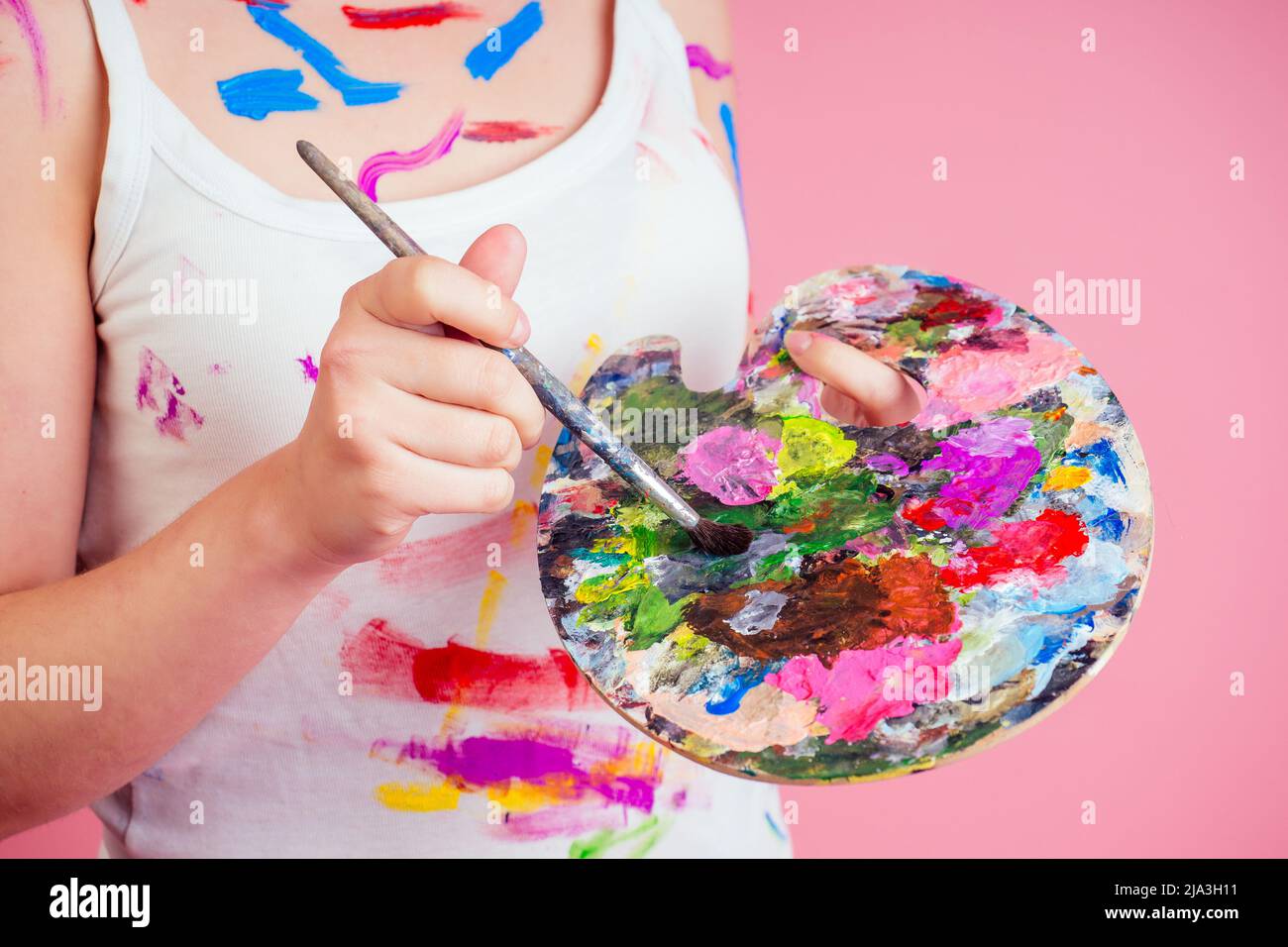hands closeup of dirty artist painter stains blot from paint on the ...