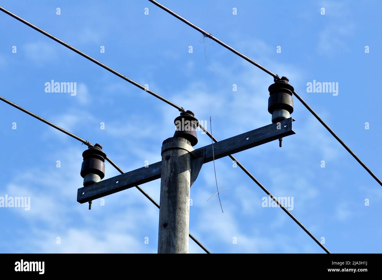 Electric cables and poles in residential in Indonesia Stock Photo - Alamy
