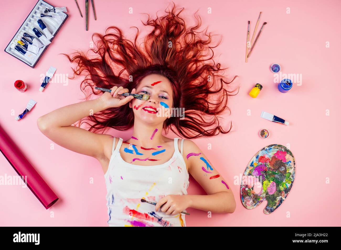 beautiful fun dirty artist painter red-haired stains blot from paint on ...