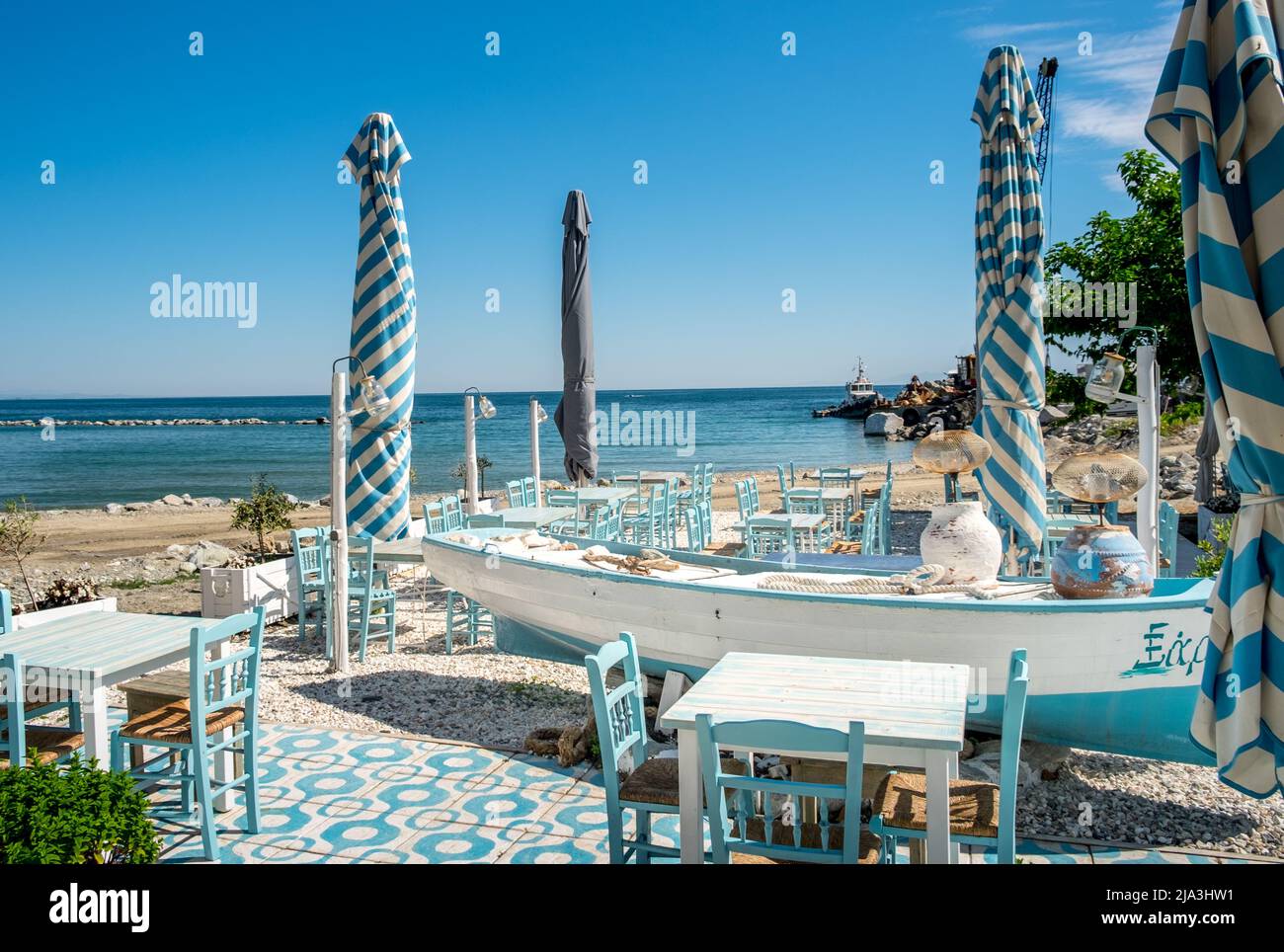 Traditional Greek restaurant or tavern in the waterfront of Platamon ...