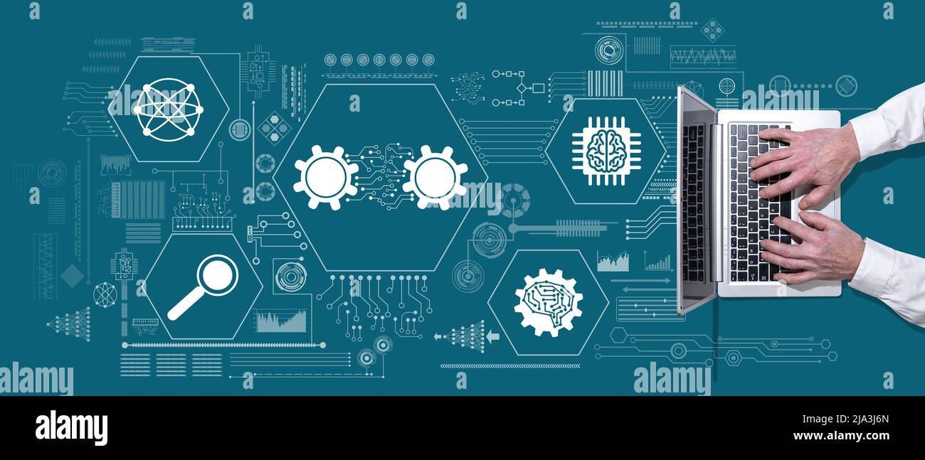 Top view of hands using laptop with symbol of machine learning concept ...