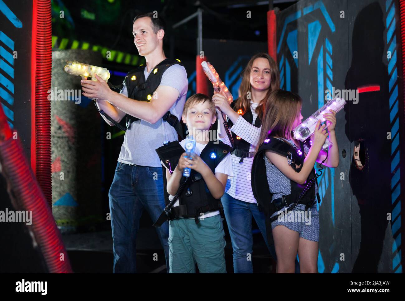 Kids and adults on lasertag arena Stock Photo - Alamy
