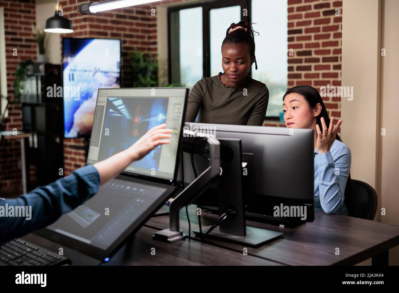 Game developers discussing team workflow in order to achieve good ...