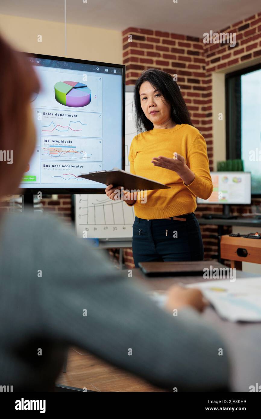 Clipboard portrait company revenue graphs hi-res stock photography and ...