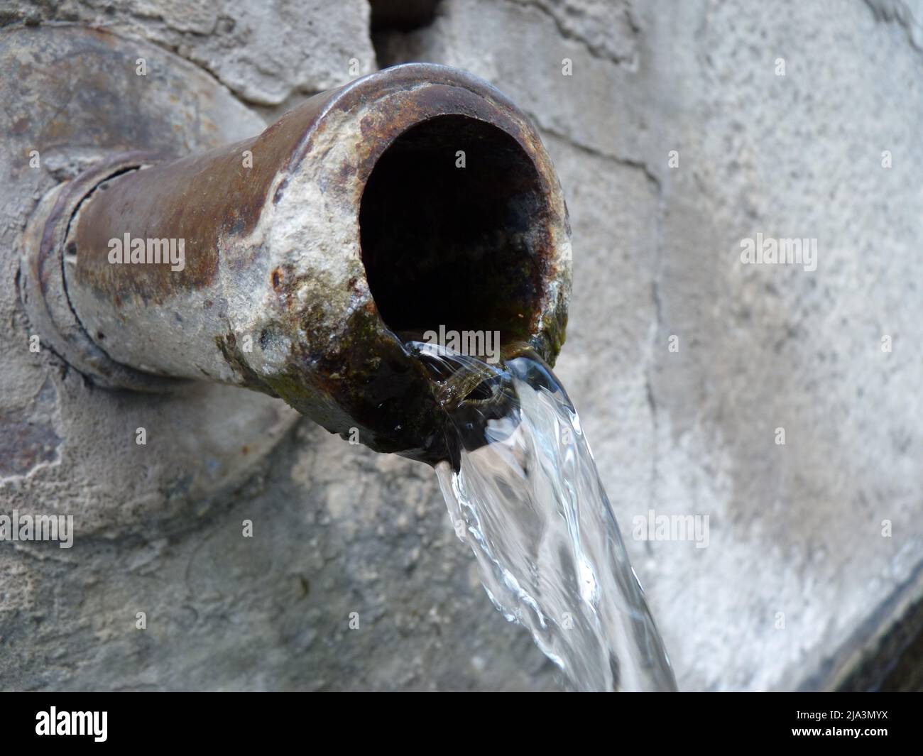 Natural Water Source from metal pipe Stock Photo - Alamy
