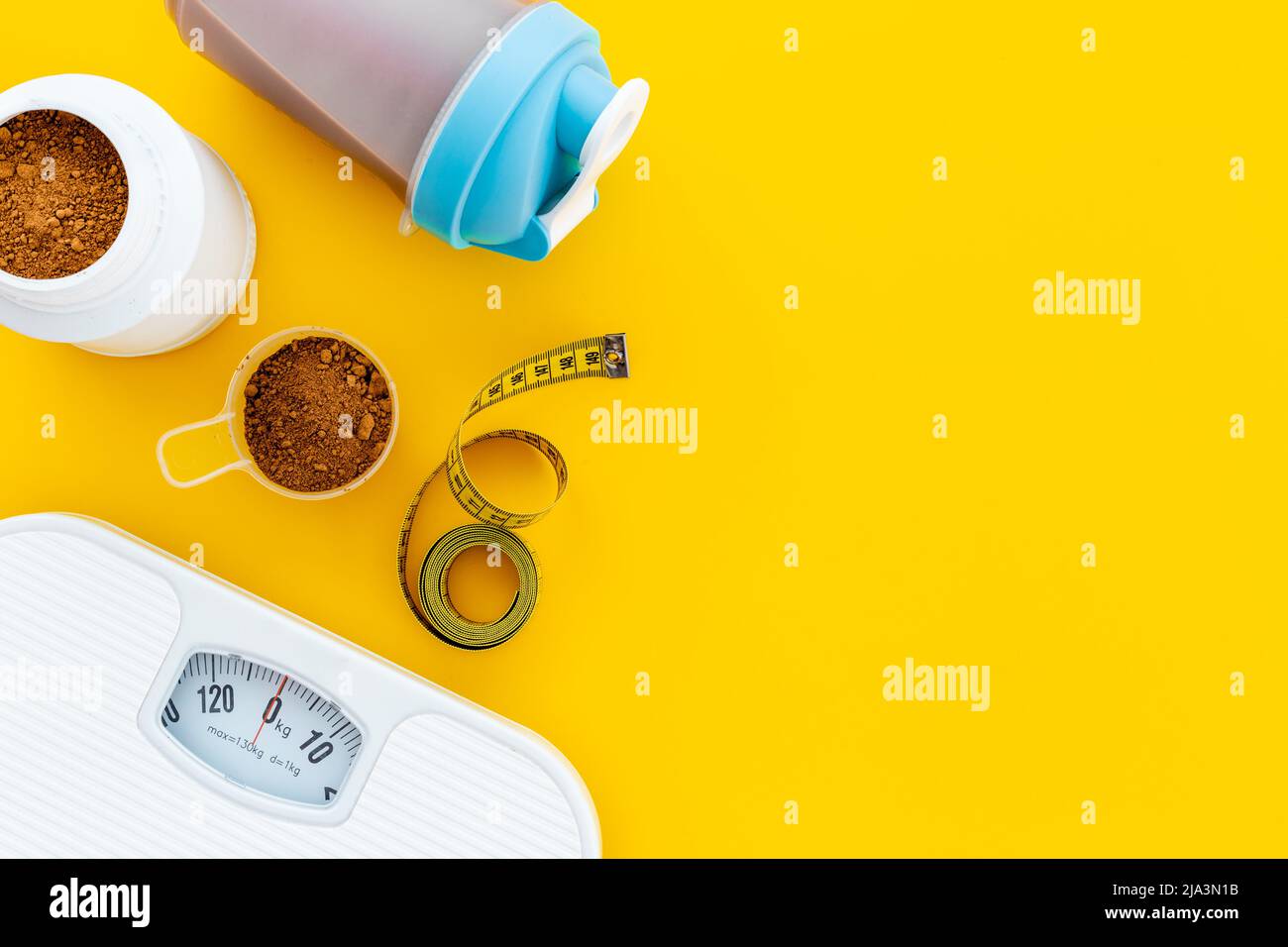 Whey protein powder in jar and scales. Fitness and gym food diet Stock ...