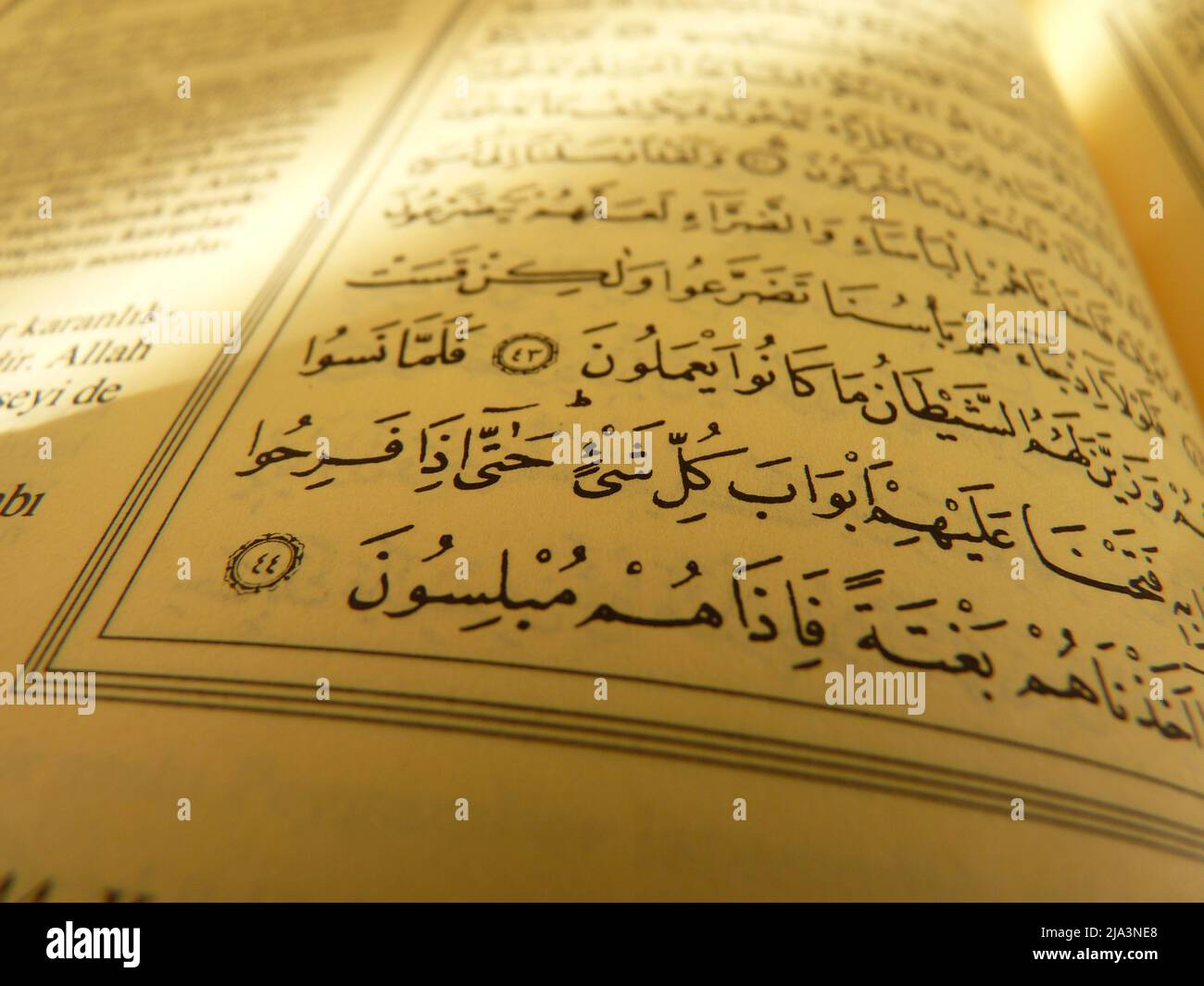 Close up photo of one of the pages of the Koran. The Koran is the holy ...