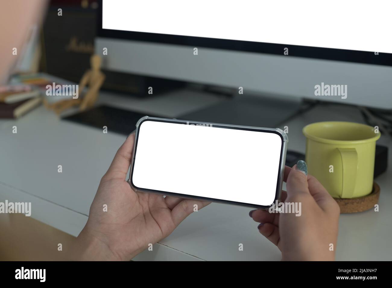 Close up view horizontal smartphone in woman hands. Blank screen for ...