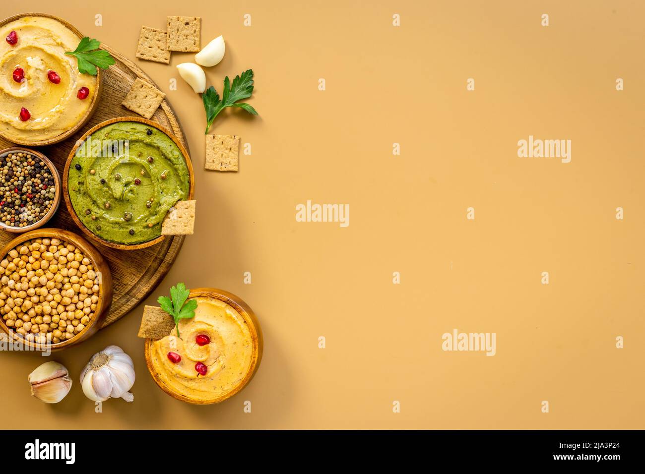 Flatlay of different types of colorful hummus in bowls. Vegan food ...