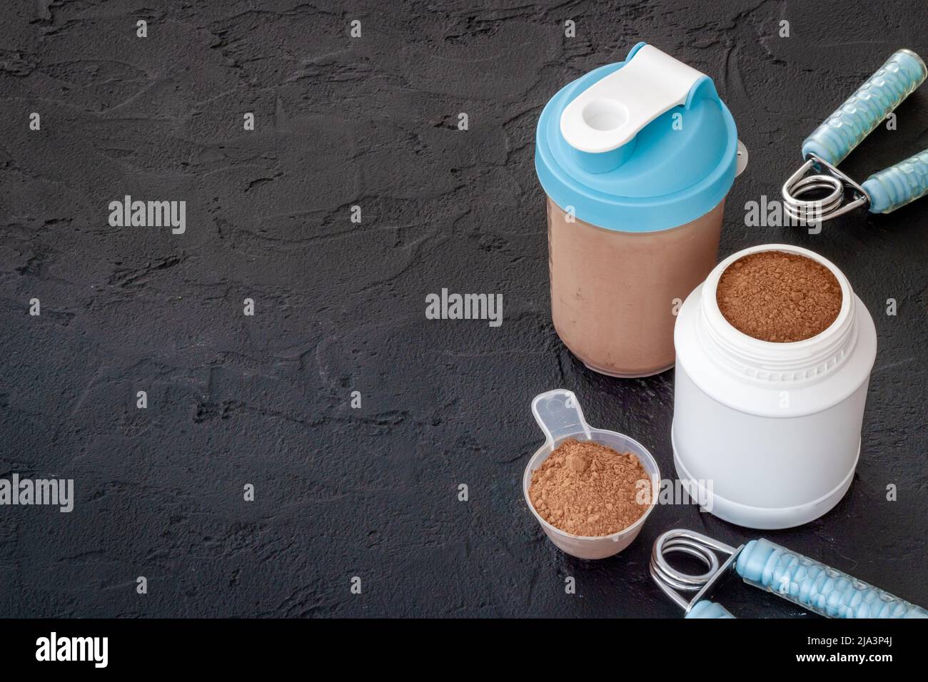 Sports food supplement. Whey protein powder in jar and shaker bottle ...