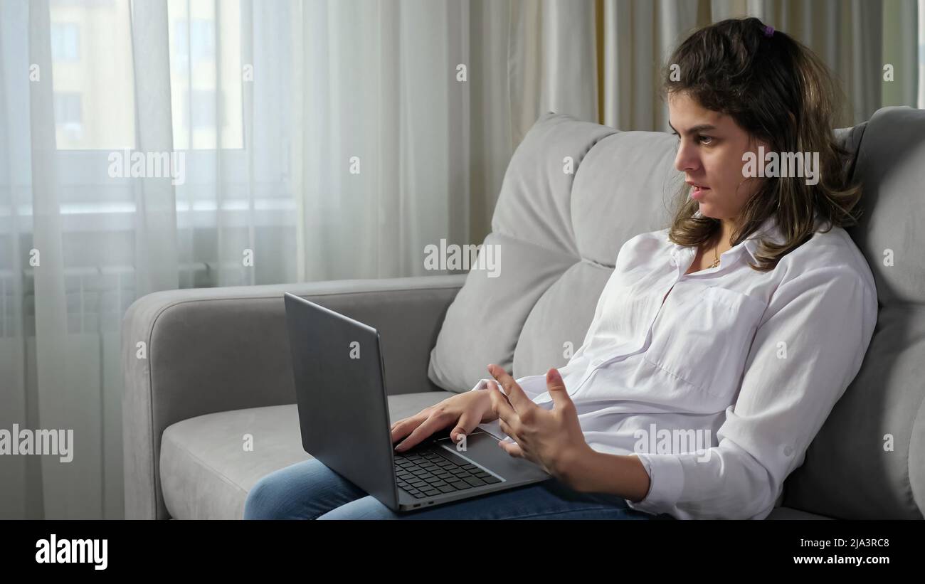 Disabled woman talks at job interview via camera on laptop Stock Photo ...