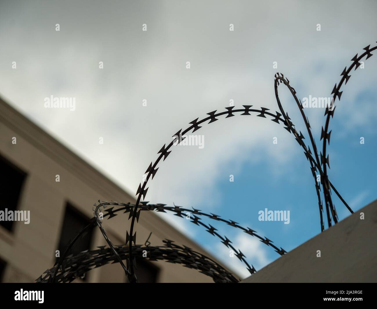 Barbed wire against the sky Stock Photo - Alamy