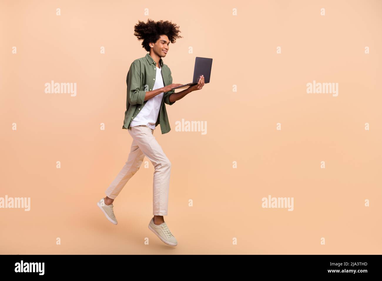 Full body profile photo of carefree active person write email use ...